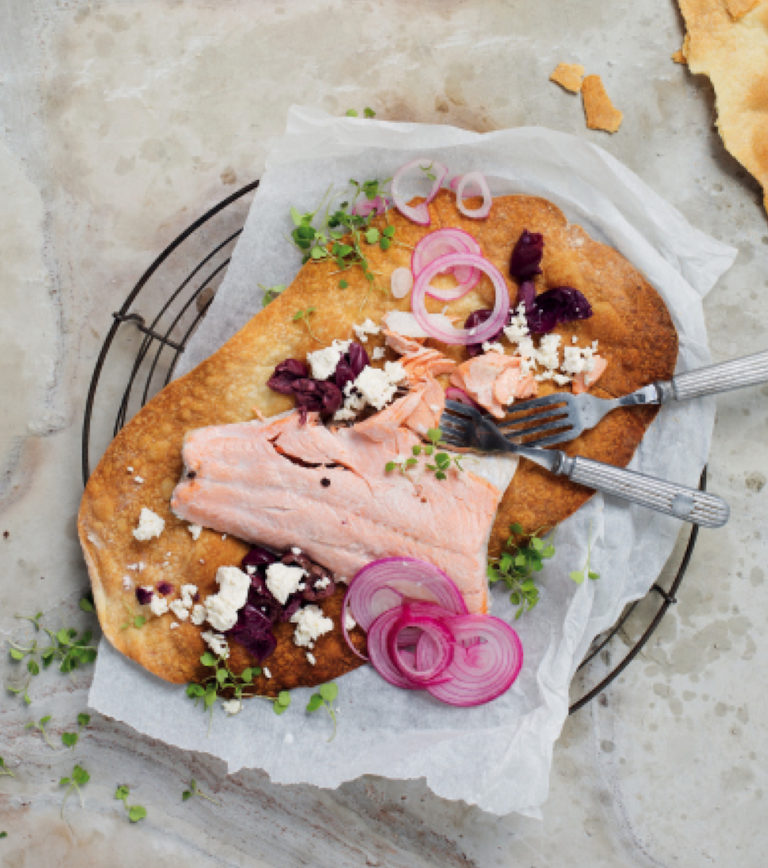 Poached trout on flatbread with olives, feta & red onion - MyKitchen